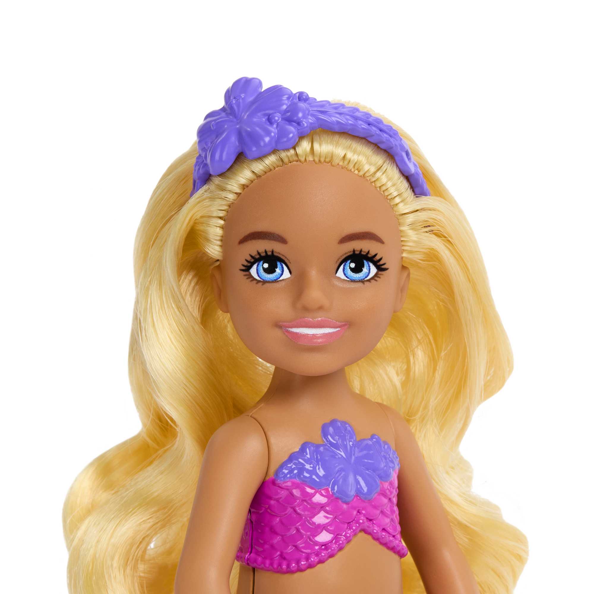 This Barbie Chelsea doll is a magical mermaid with wavy blond hair, a ...